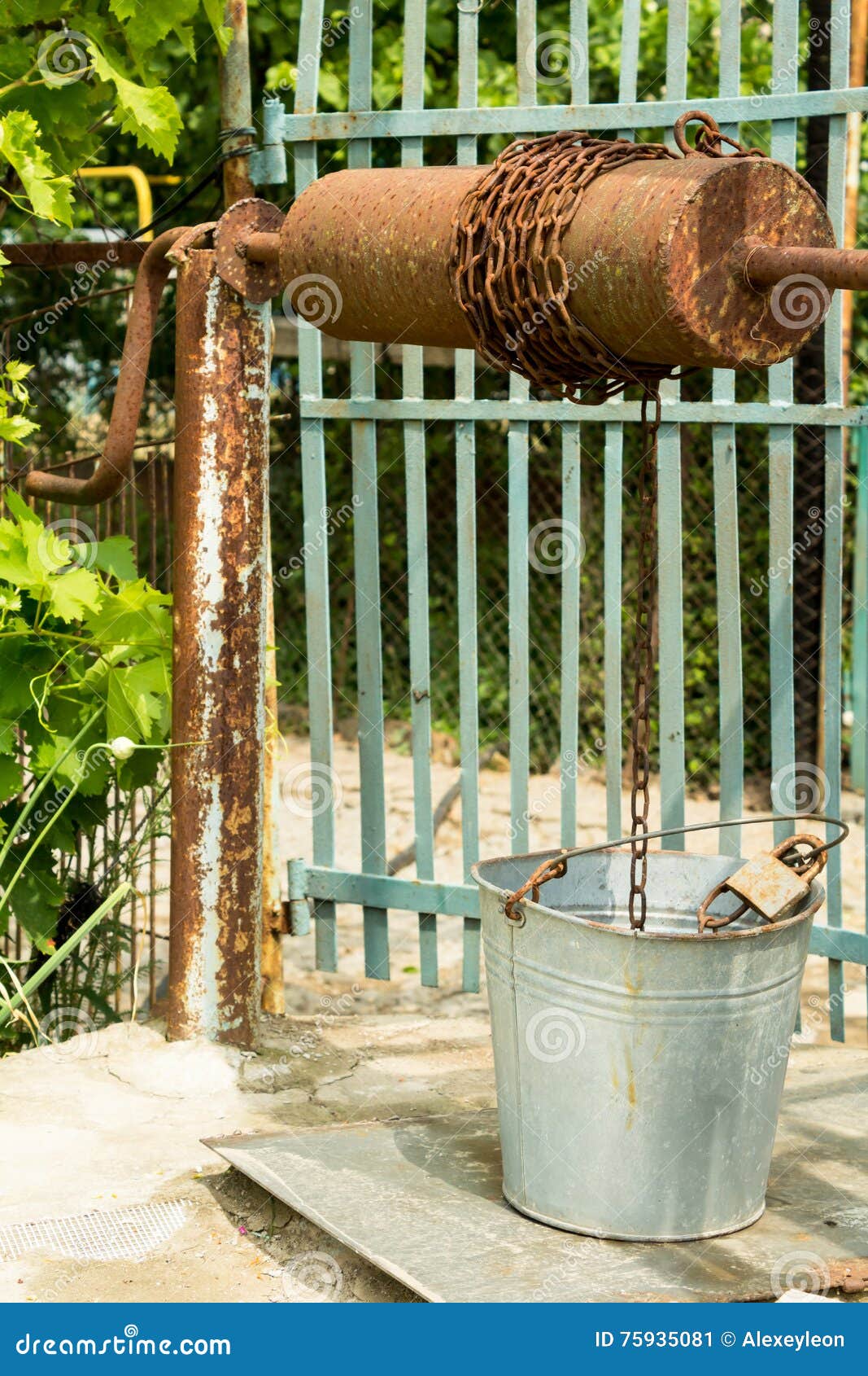 Well Water and a Bucket on a Chain Stock Image - Image of antique ...