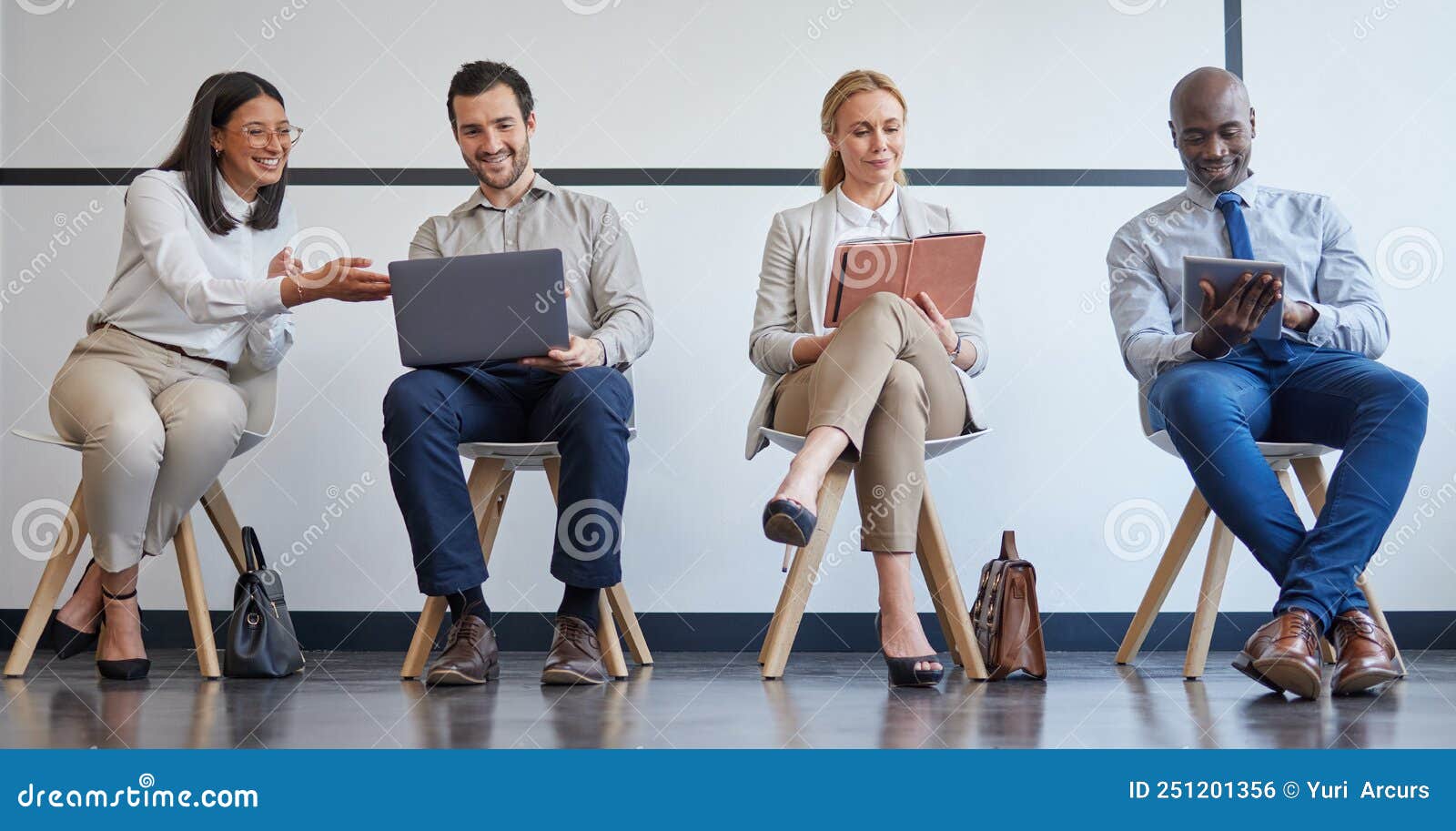 Were All Just Playing the Waiting Game. a Group of Businesspeople Using ...