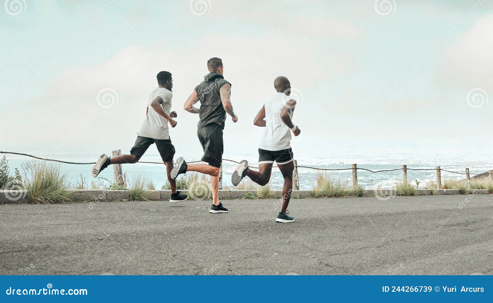 Were almost at the Finish Line. Shot of a Group of Men Exercising in ...