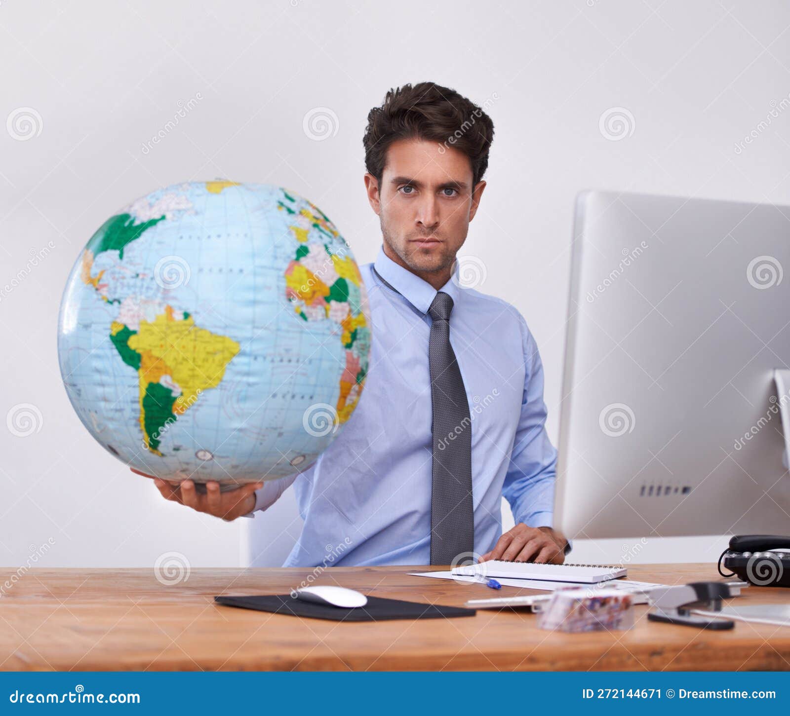 Were Going Global. a Handsome Young Businessman Holding a Globe. Stock ...
