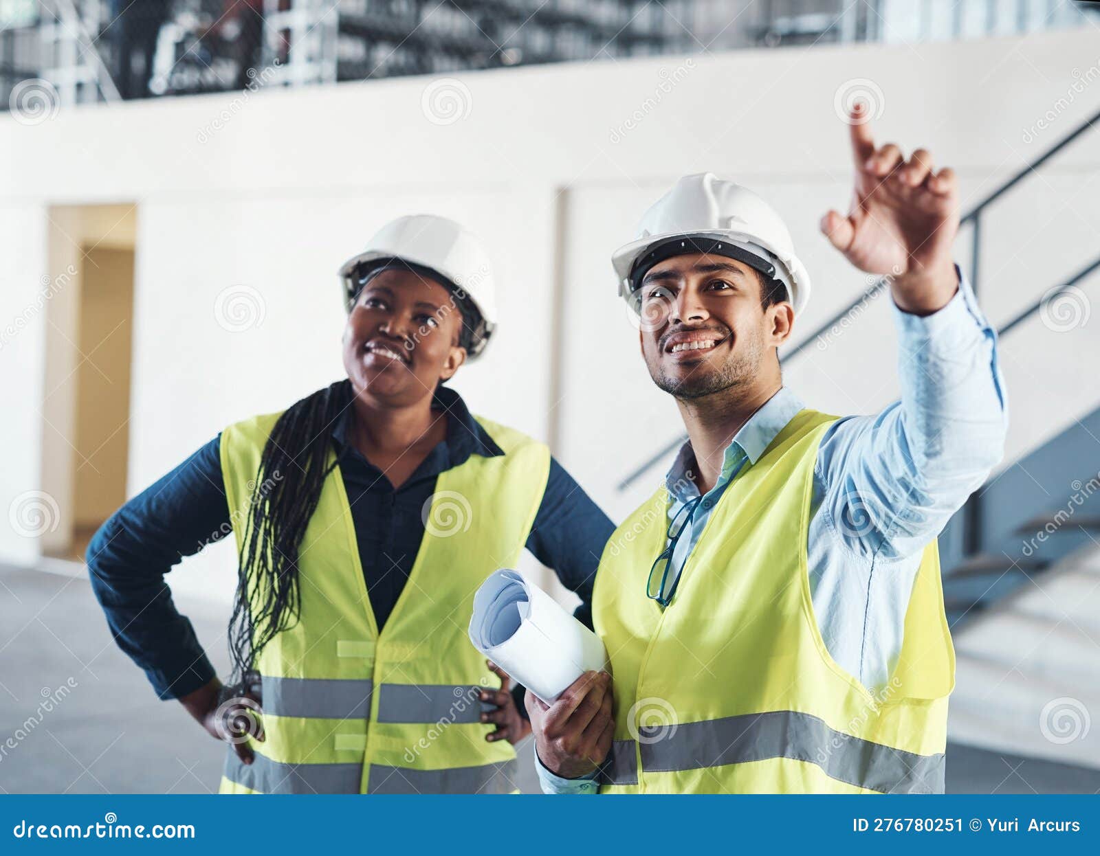 Were Planning on Adding More Space Here. Two Young Contractors Standing ...