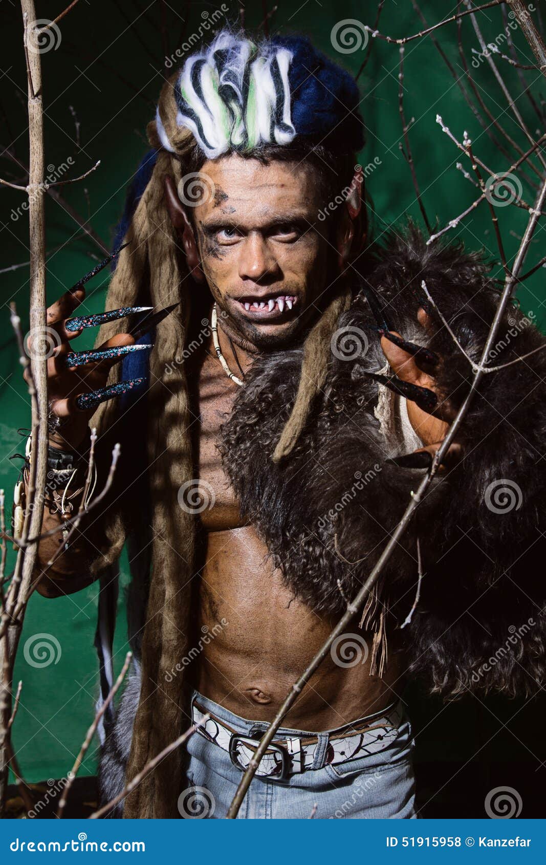Werewolf with Long Nails and Crooked Teeth among the Branches of Stock ...