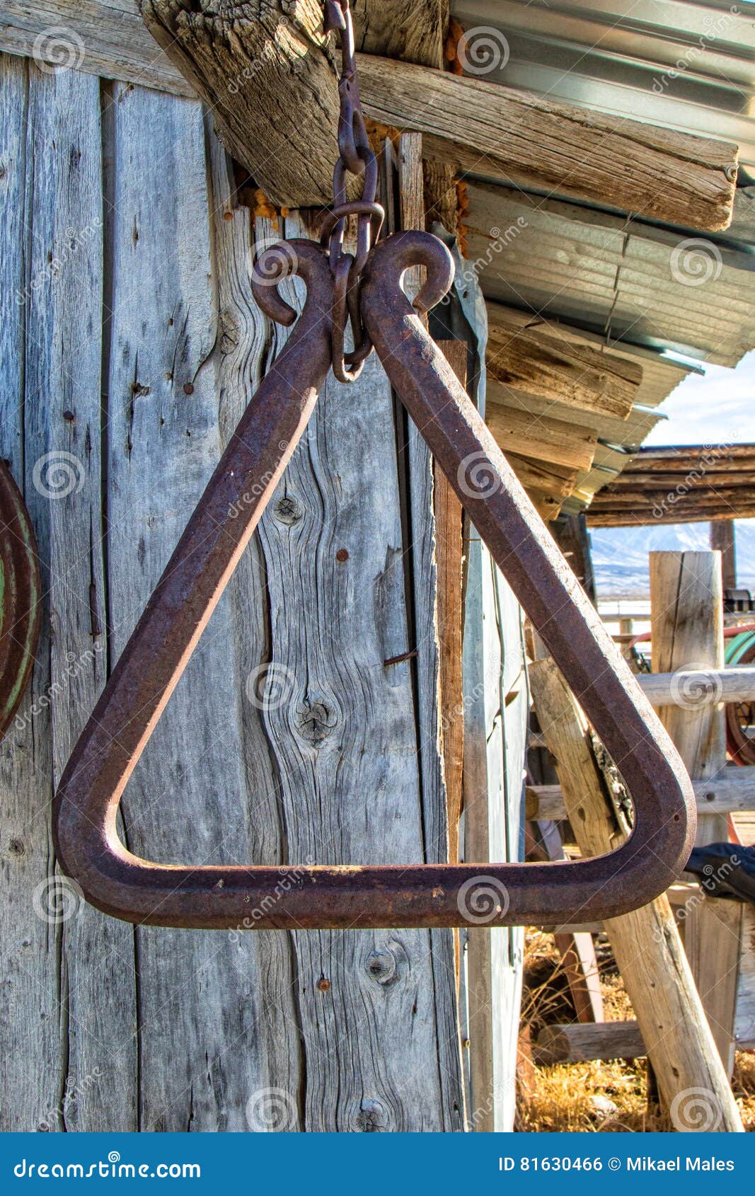 Western dinner bell stock photo. Image of triangle, western - 81630466