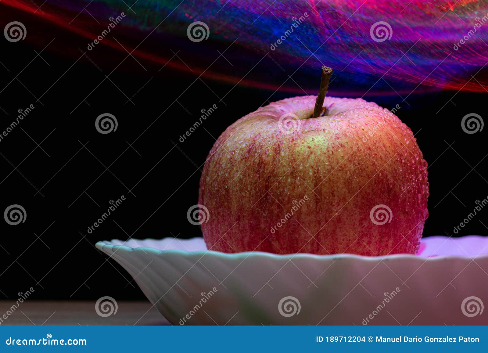 Wet Apple with a Abstract Background Stock Photo - Image of neon ...