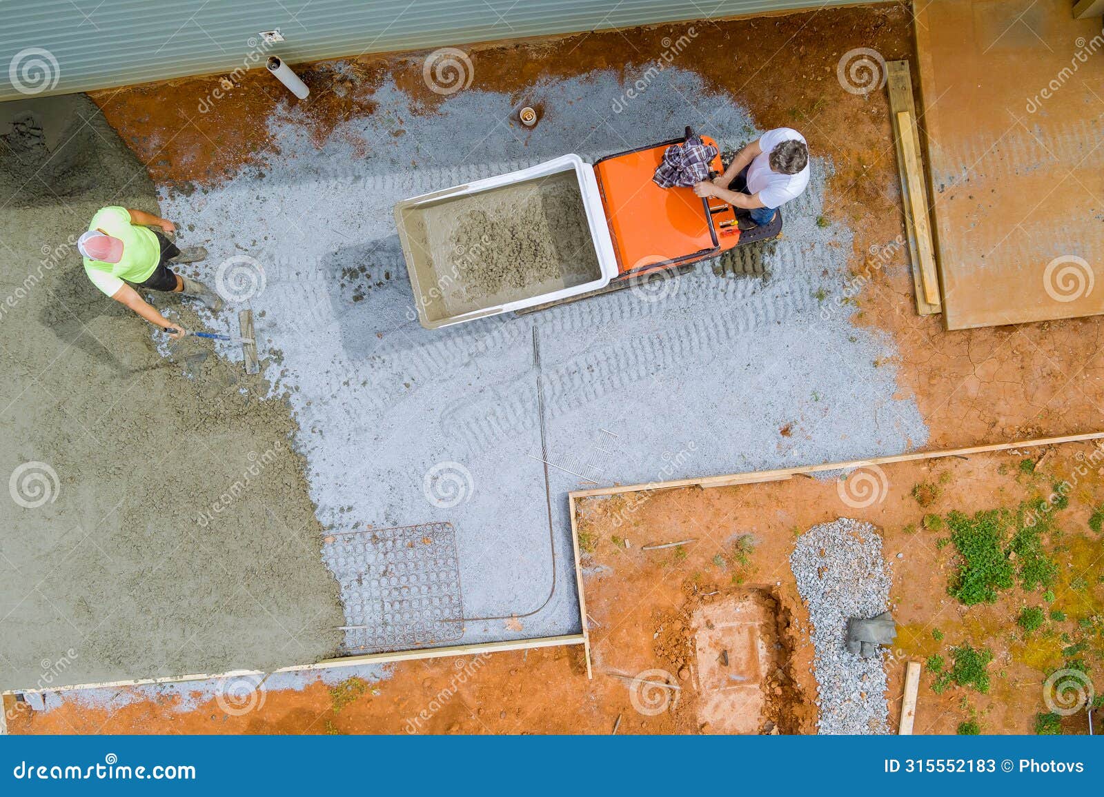 Wet Cement is Poured into Framework Using a Self Dumping Track Concrete ...
