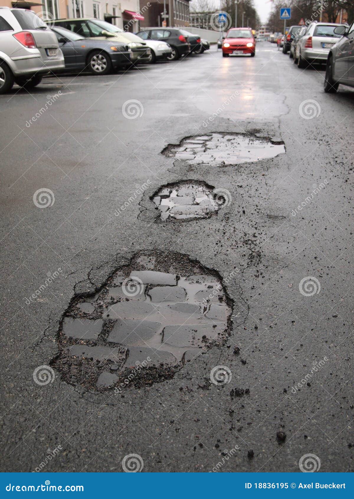 Wet City Street with Potholes Stock Image - Image of town, damaged ...