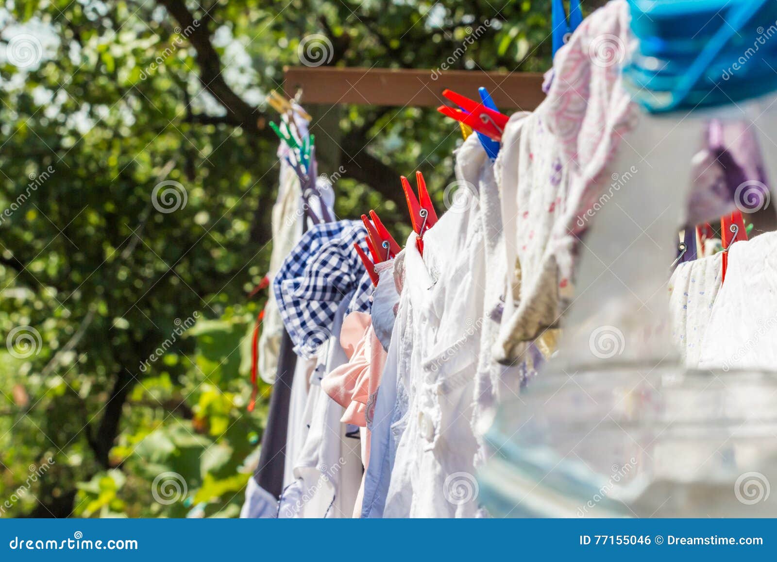 Wet Clothes with Clothespins on the Rope Stock Photo - Image of fashion ...