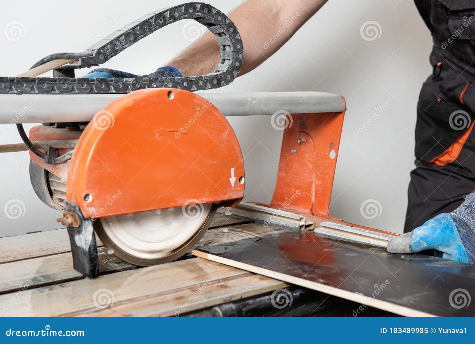 Wet cutting a ceramic tile stock image. Image of renewal - 183489985