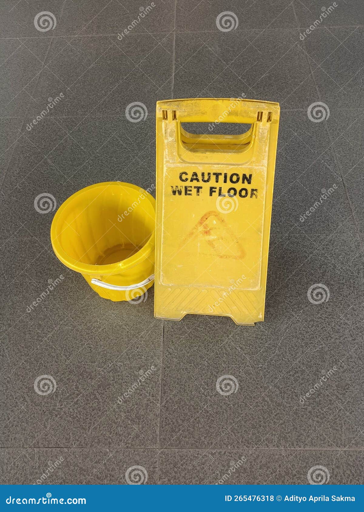 Wet Floor Warning Sign with Yellow Bucket Stock Photo - Image of ...