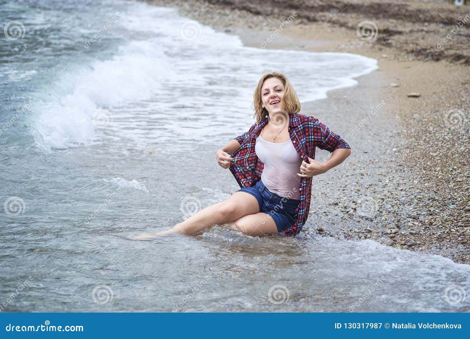 Wet Girl Sitting In The Water On The Sea Beach Stock Image Image Of