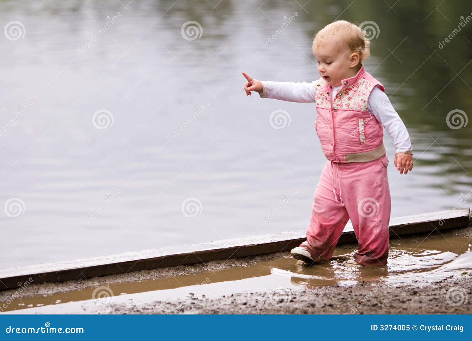 Wet girl toddler in puddle stock image. Image of stage - 3274005
