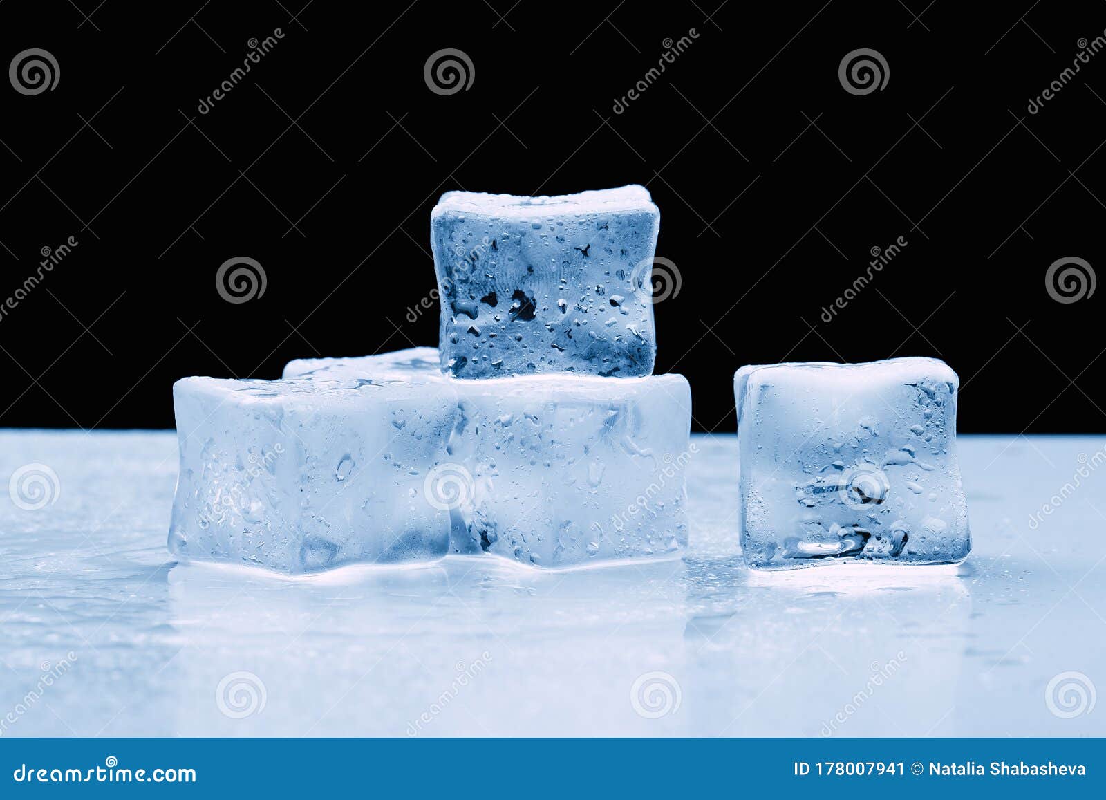 Wet Ice Cubes with Drops on a Dark Black Background Stock Image - Image ...