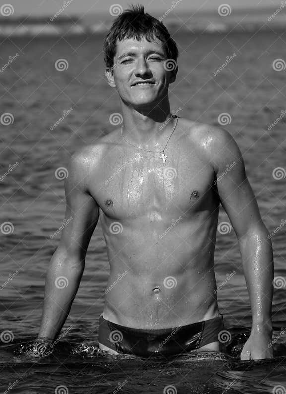 Wet man in the water stock photo. Image of front, face - 21212086