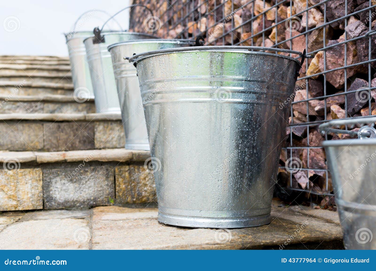 Wet Metal Buckets on Stairs Stock Photo - Image of household, clean ...