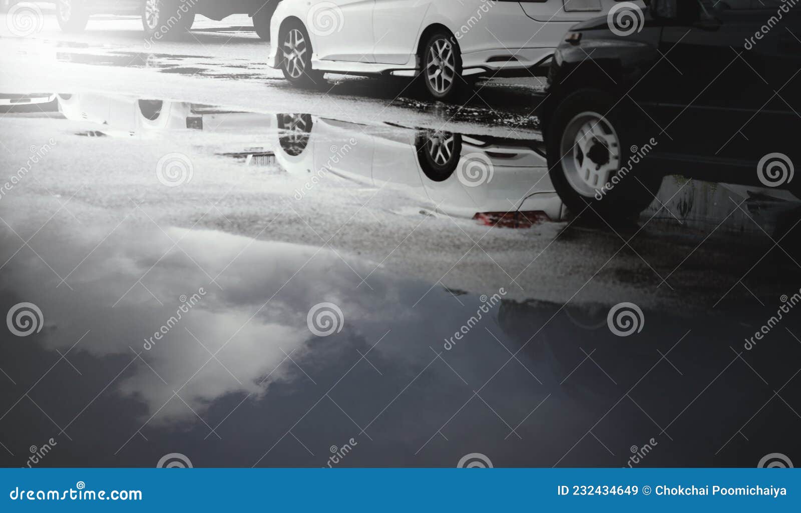 Wet Parking Spaces after Hard Rain Fall with Reflection in Puddle on ...