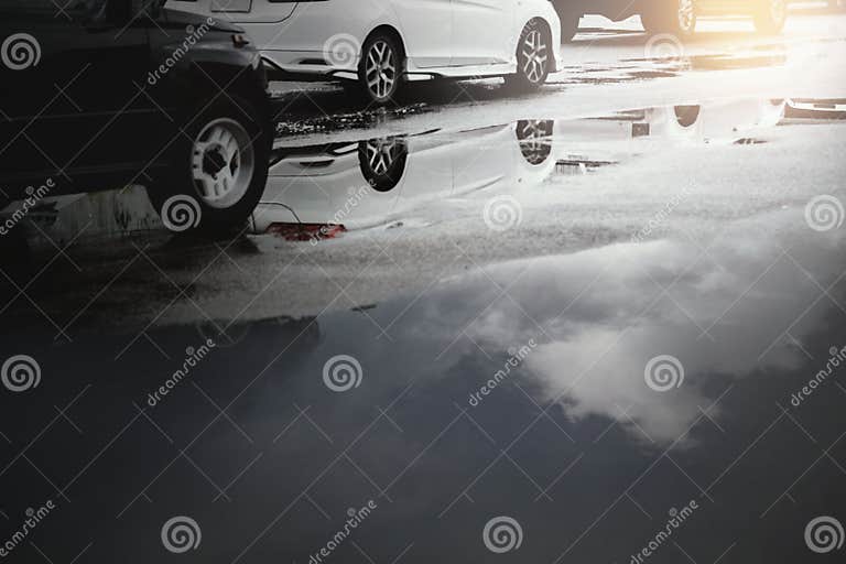 Wet Parking Spaces after Hard Rain Fall with Reflection in Puddle on ...