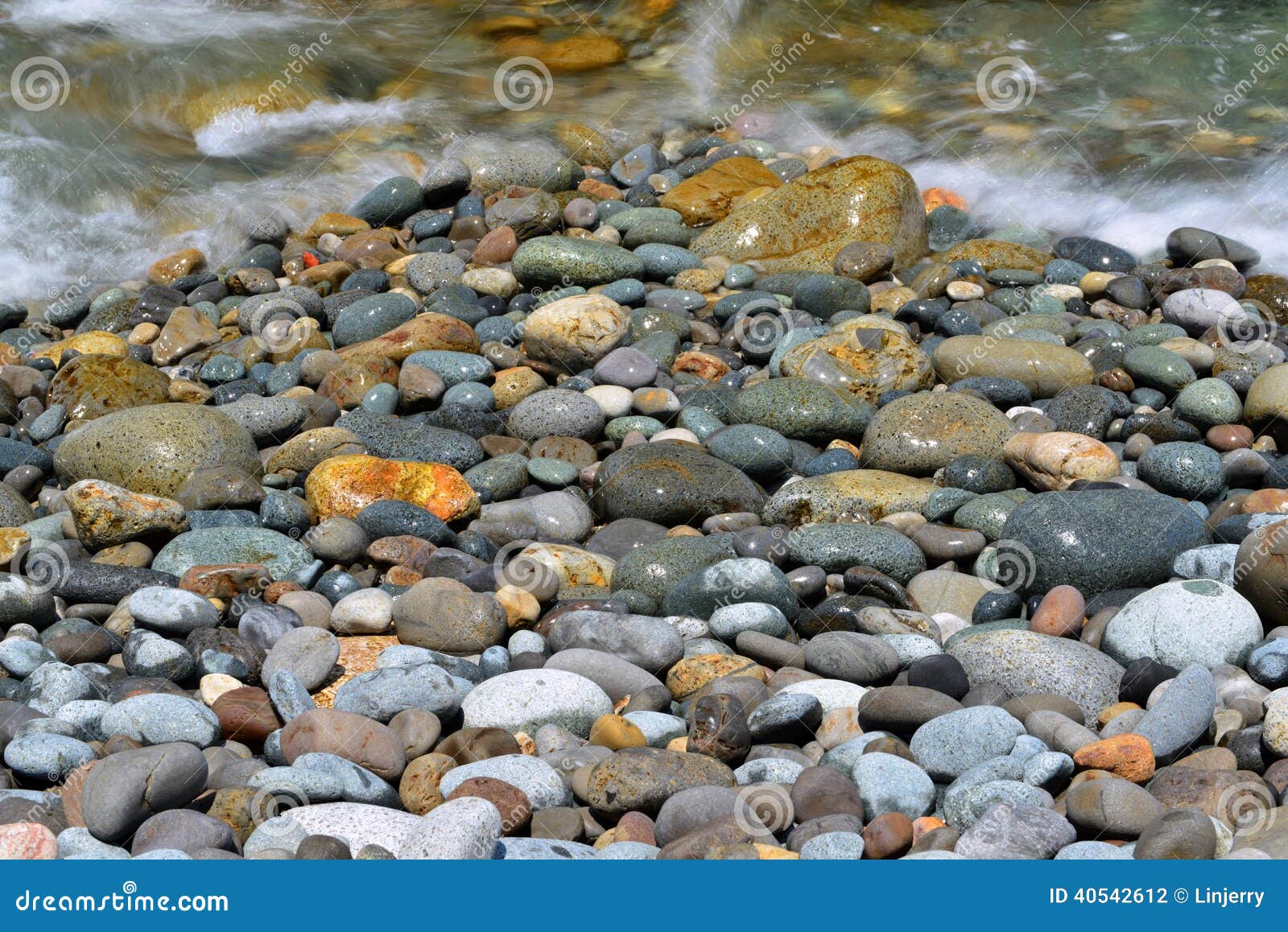 Wet Pebbles on beach stock photo. Image of cold, pebble - 40542612