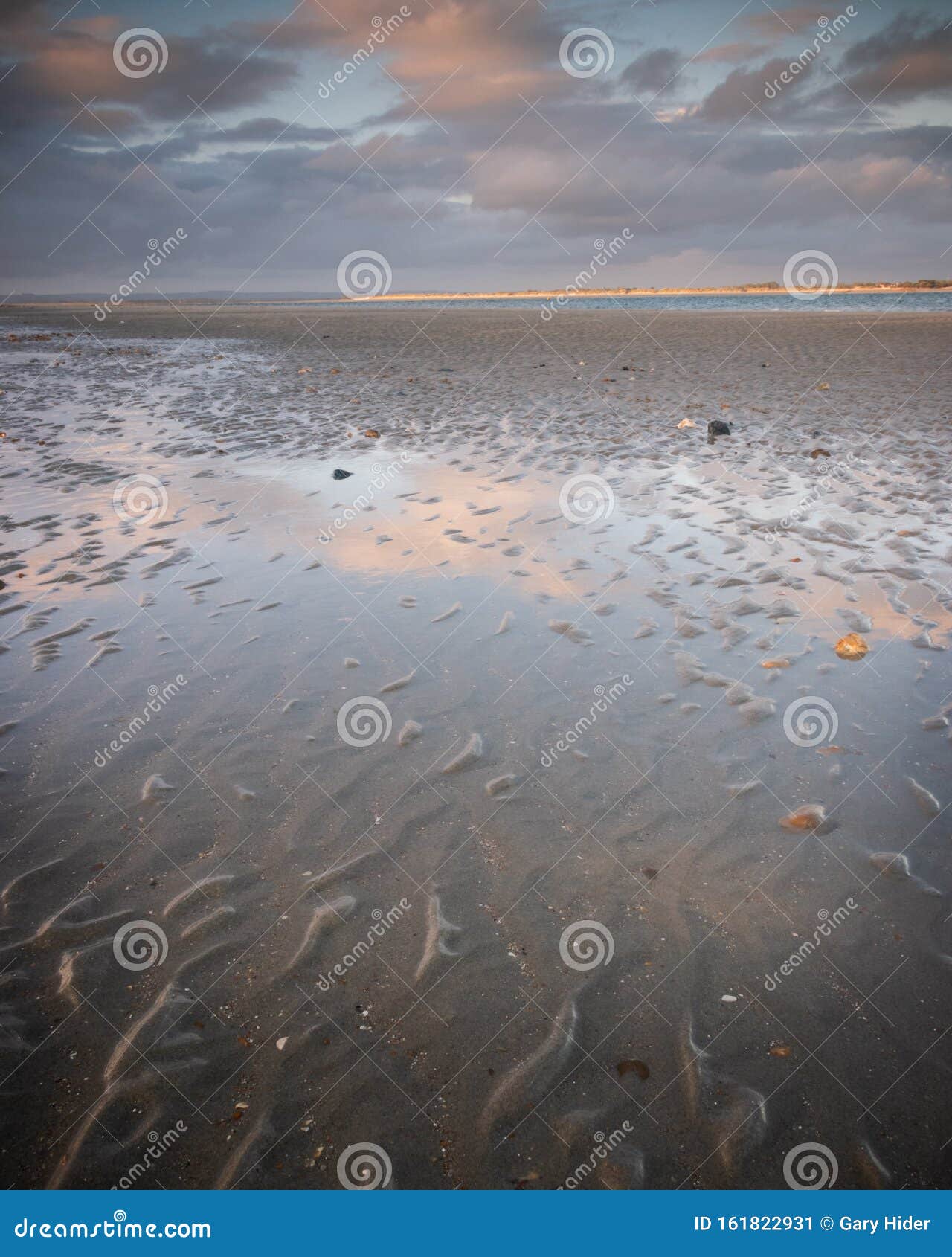 A Wet Sandy Beach at Sunset Reflecting in Wet Sands Stock Image - Image ...