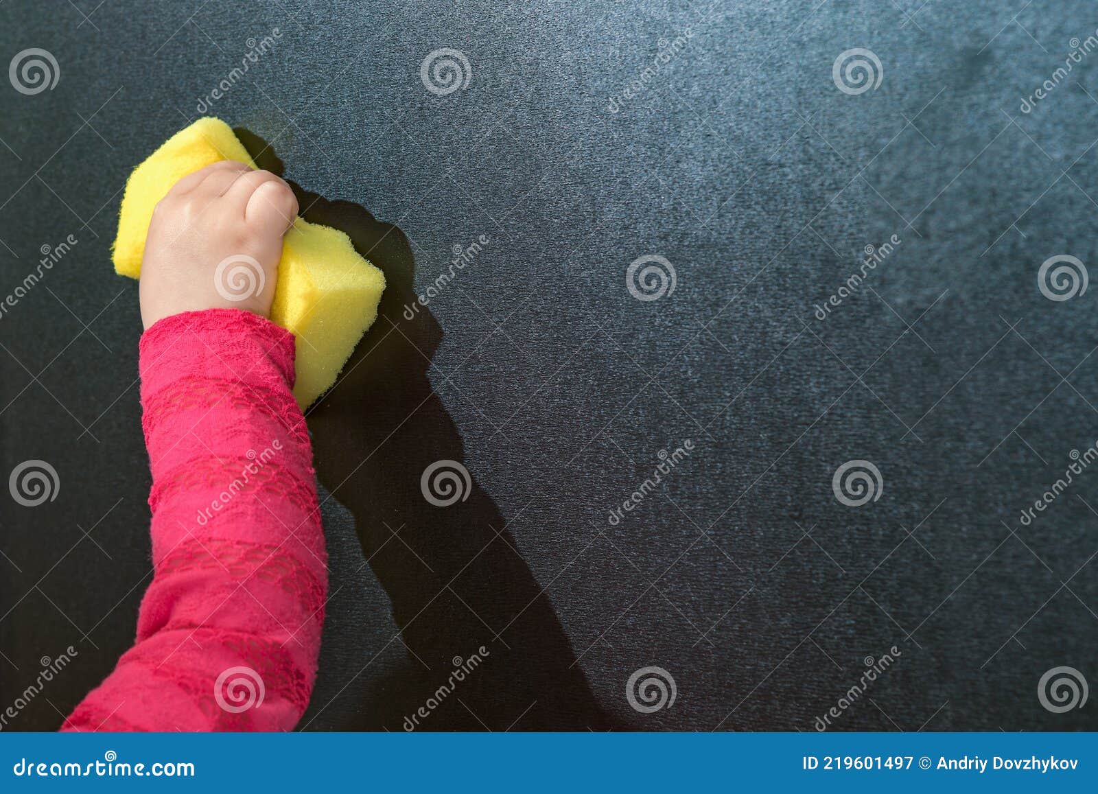 A Wet Sponge in the Hand of a Child Wiping a Blackboard Stock Image ...
