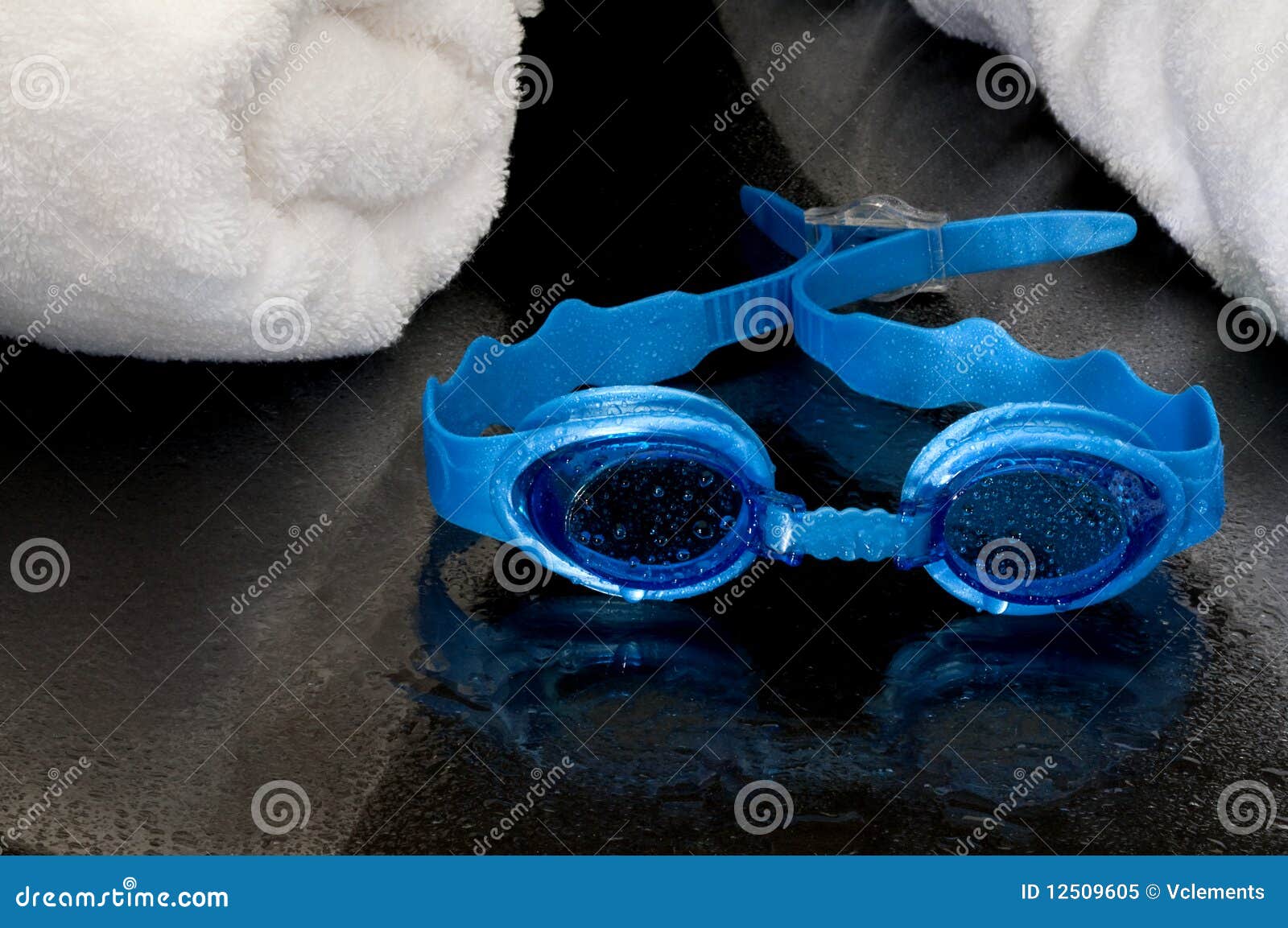 Wet Swimming Goggles and Towels Stock Image - Image of blue, spash ...