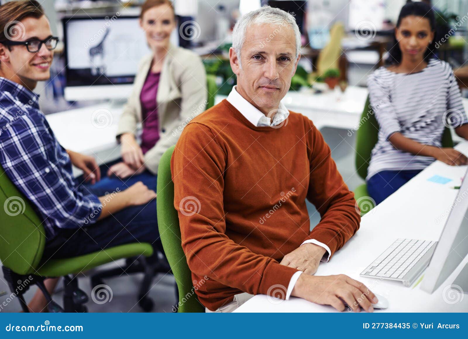 Weve Got Everything Covered. Portrait of Coworkers Sitting at Computers ...
