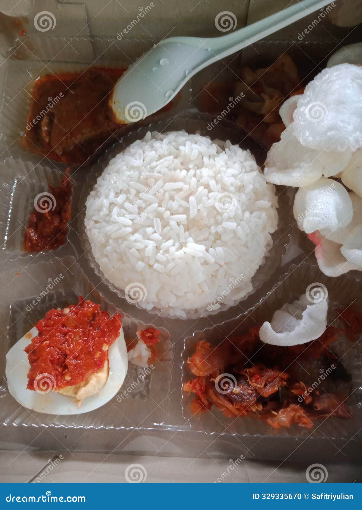 Boxed Rice With A Variety Of Side Dishes, Namely Chicken Wings, Eggs ...