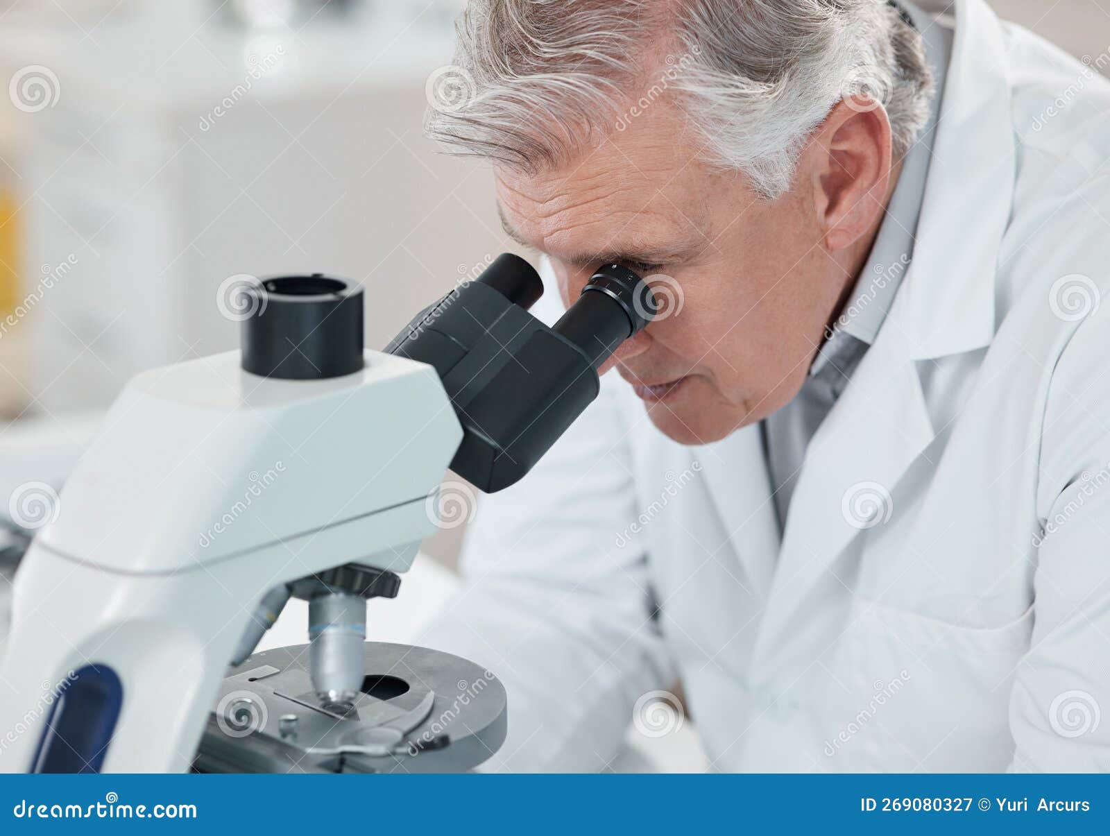 What a Curious Discovery. a Mature Scientist Using a Microscope in a ...