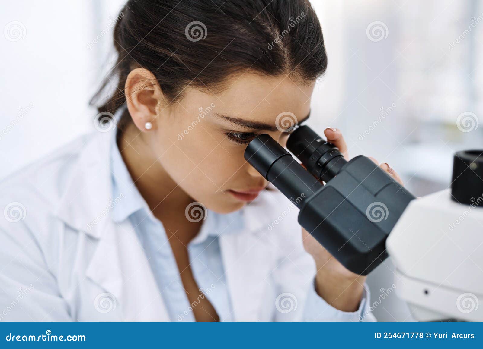 What Do we Have Here...a Young Scientist Using a Microscope in a Lab ...