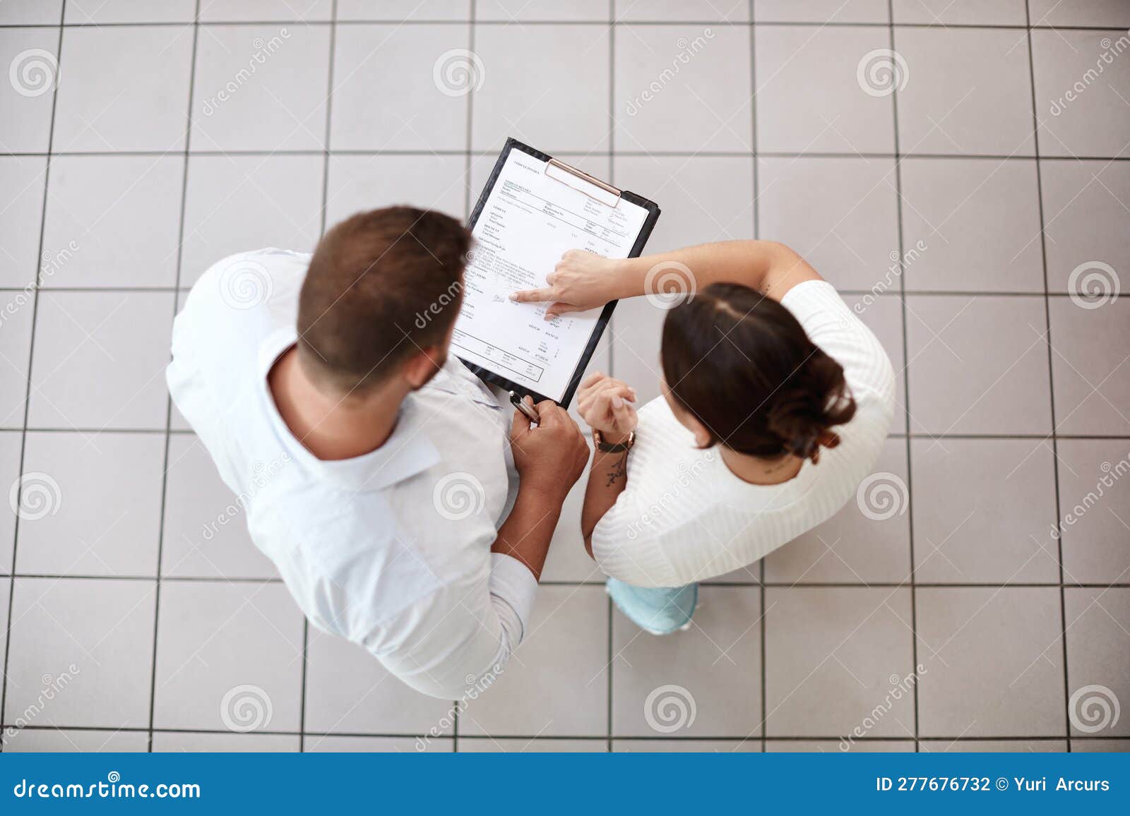 What Does this Mean. a Customer Reading Over Paperwork with Her ...