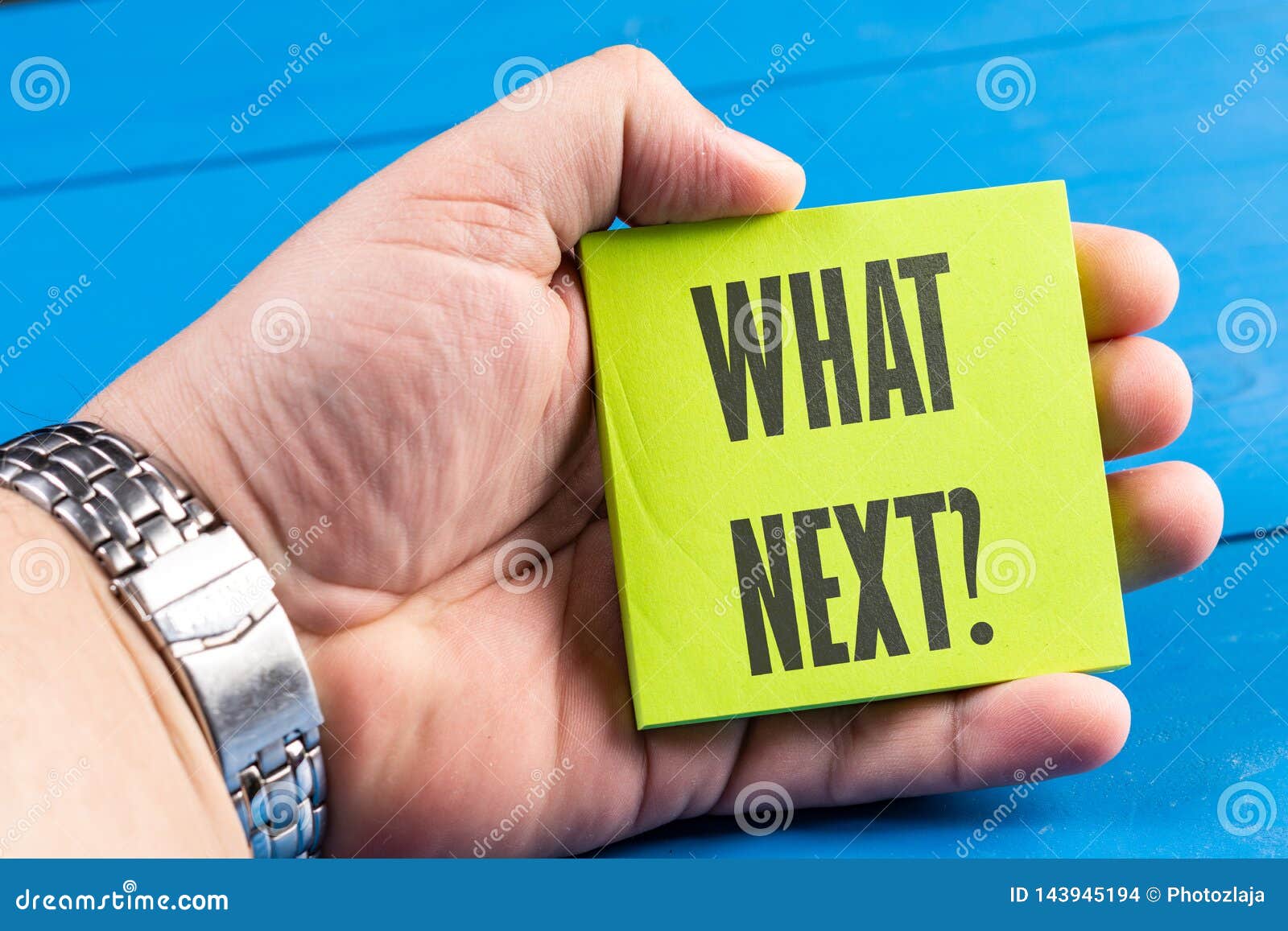 What Next Text Concept on the Sticky Notes Paper in the Hand Stock ...