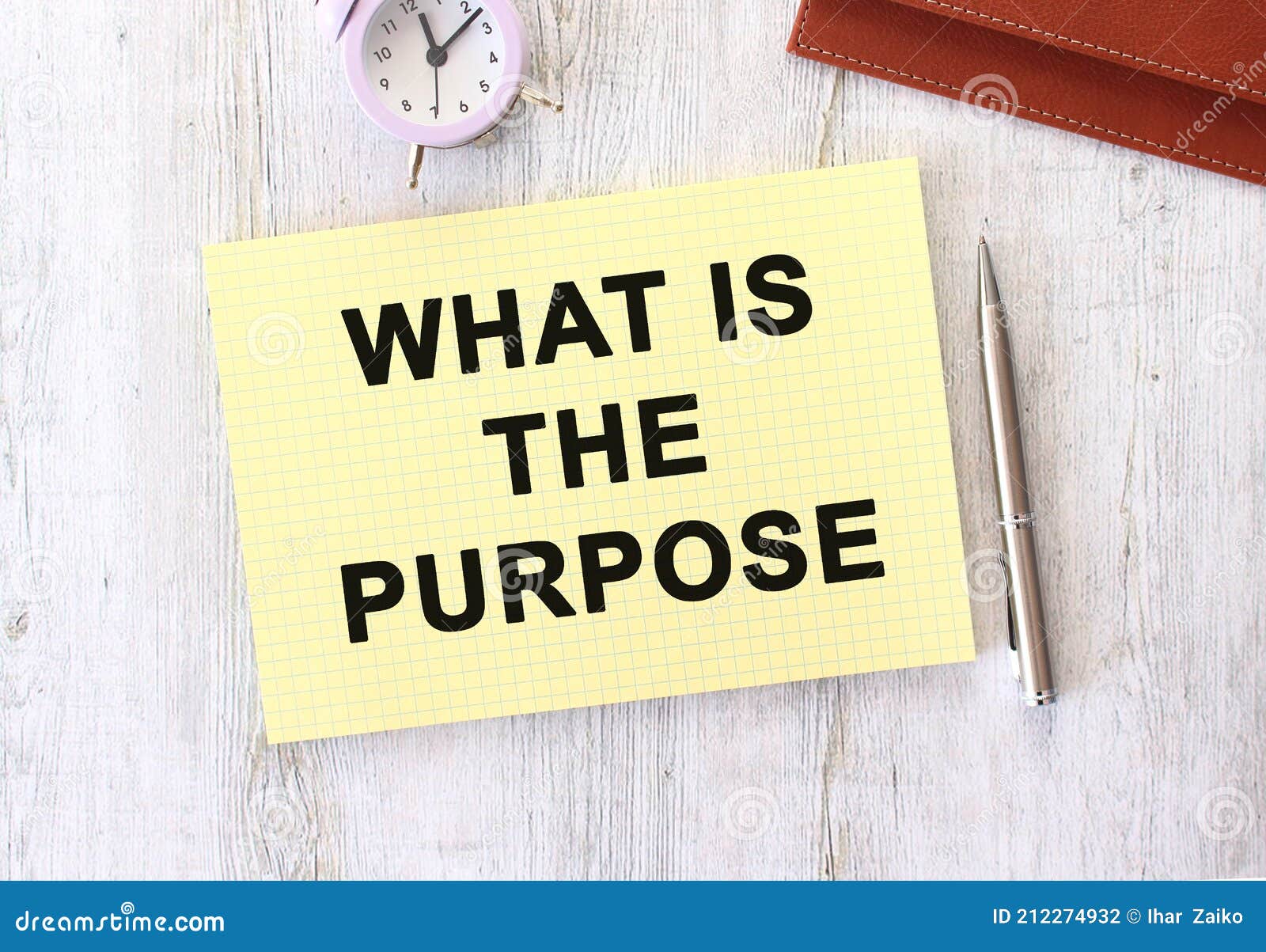 WHAT is the PURPOSE Text Written in a Notebook Lying on a Wooden Work ...