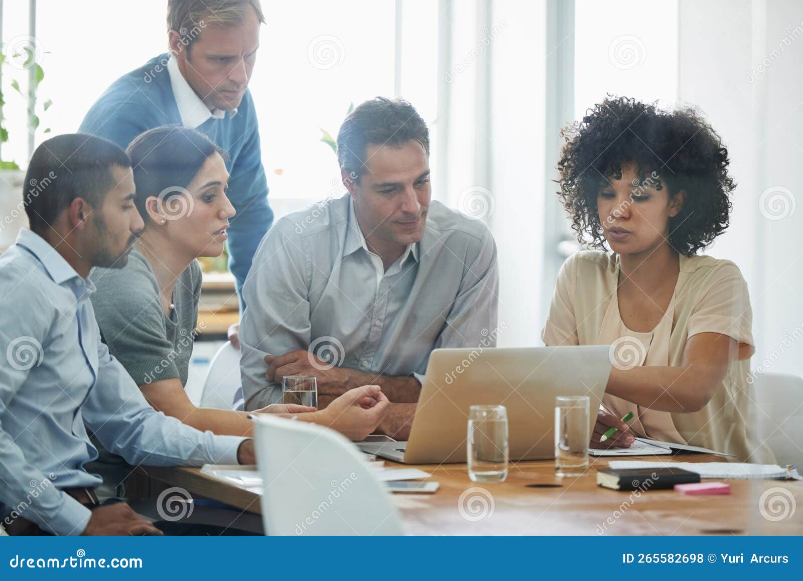 This is What Teamwork Looks Like. a Group of Professionals Using ...