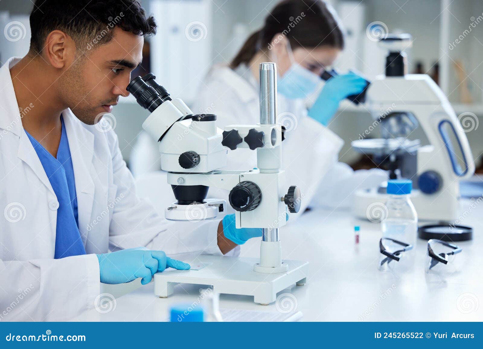 What Will we Discover Today. Shot of Two Scientists Using Microscopes ...