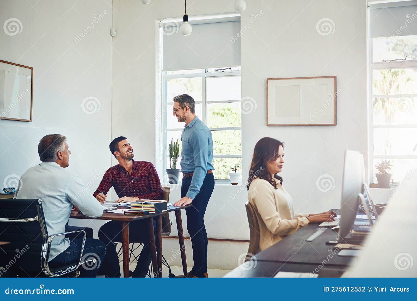 This is What a Working Office Looks Like. a Group of Colleagues Working ...