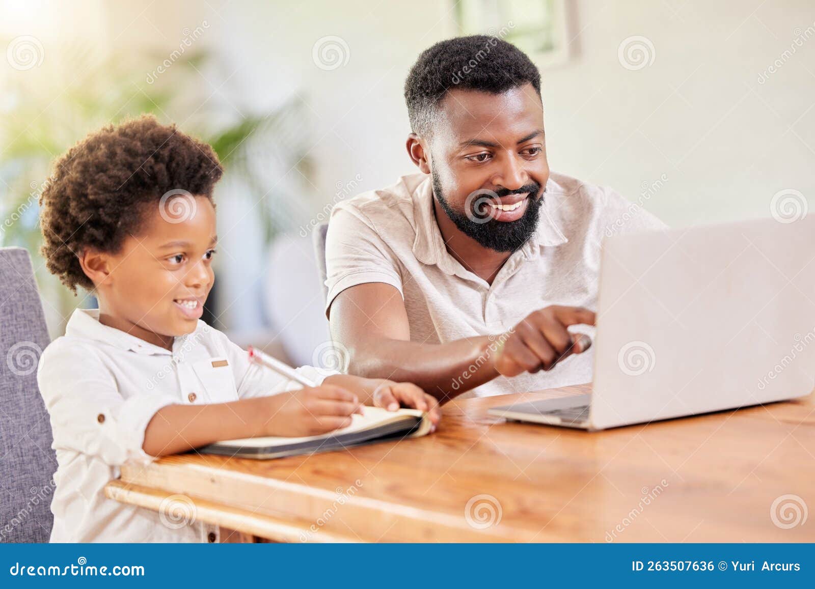 Whats the Next Problem. a Father Helping His Son with Homework at Home ...