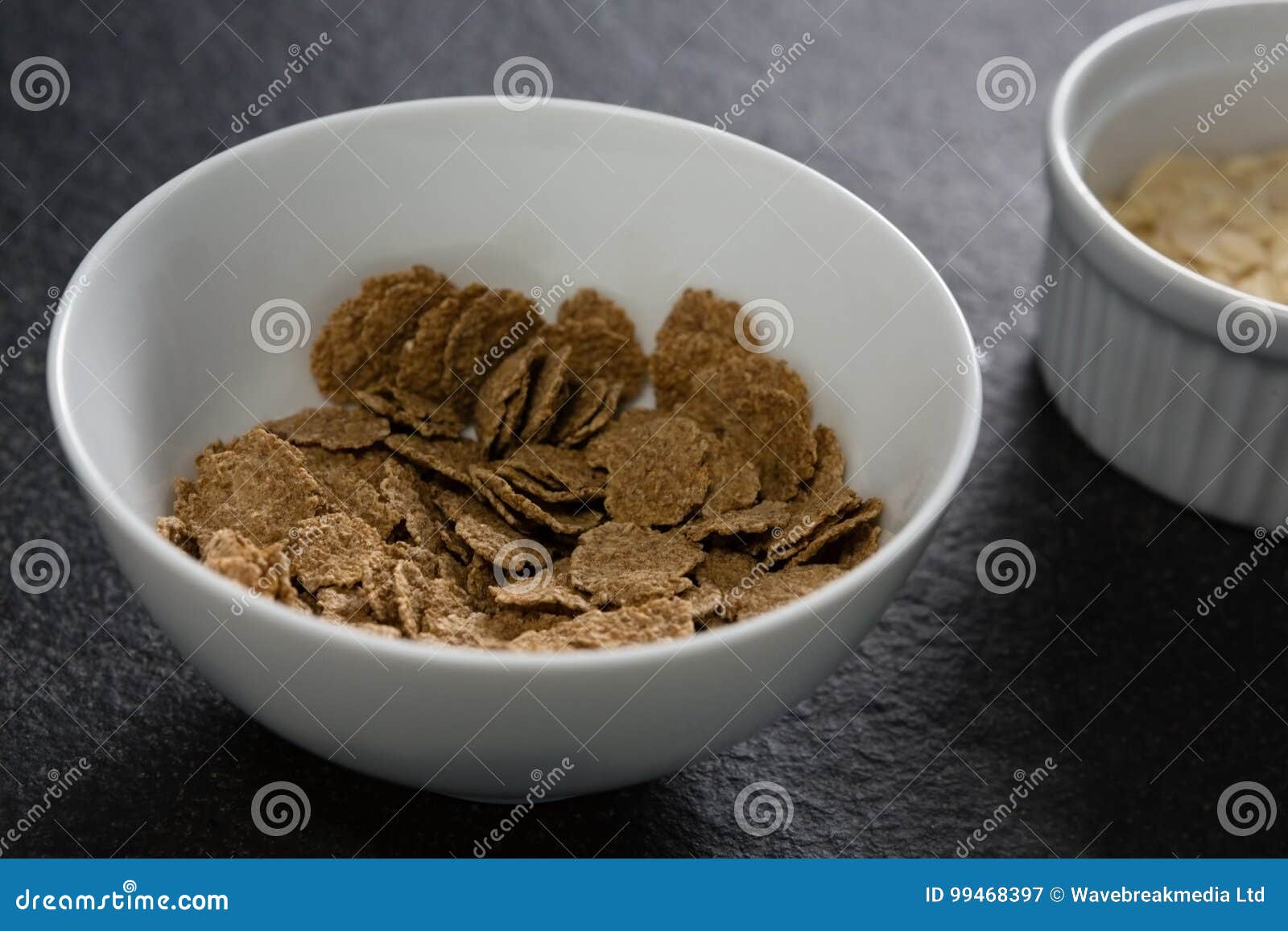 Wheat flakes in bowl stock image. Image of cereal, nutrition - 99468397