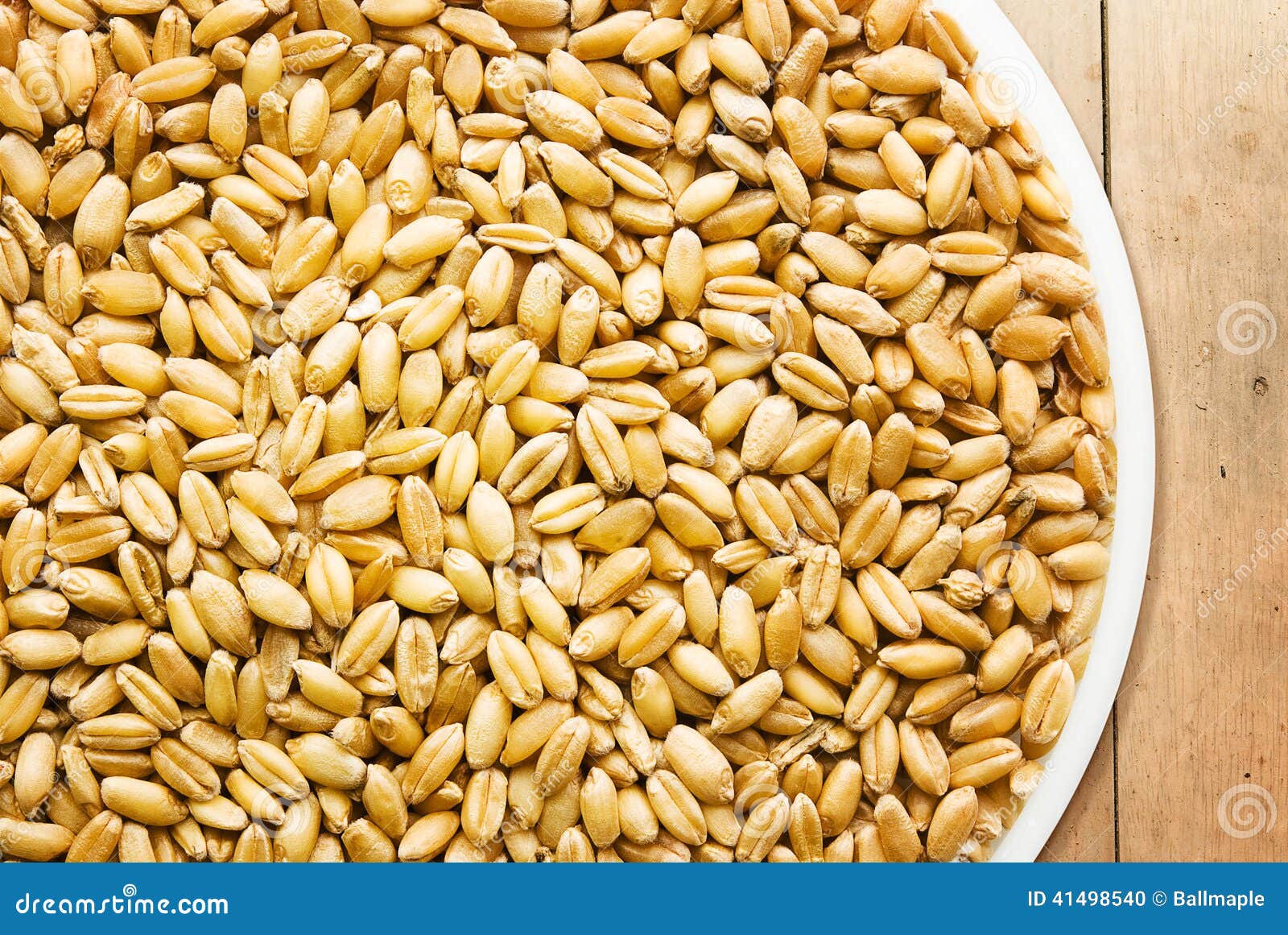 Wheat on wooden floor stock photo. Image of heap, natural - 41498540