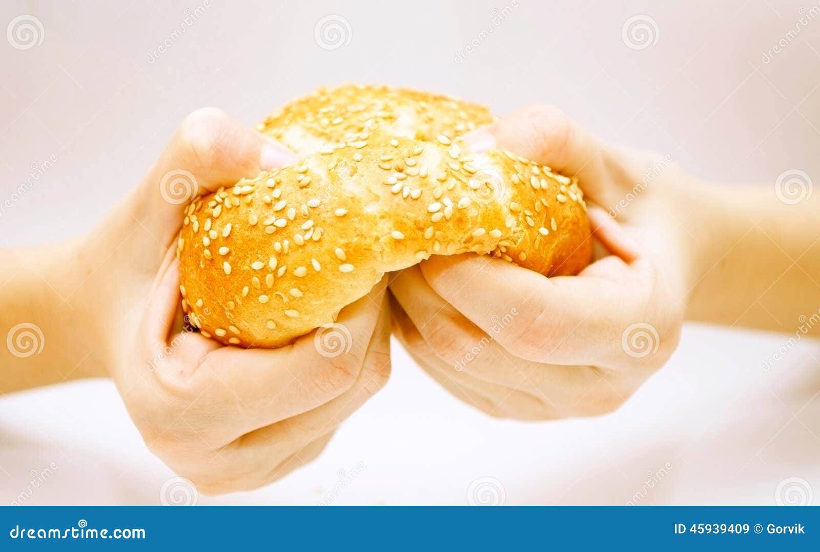 Wheaten roll in hands stock image. Image of roll, meal - 45939409