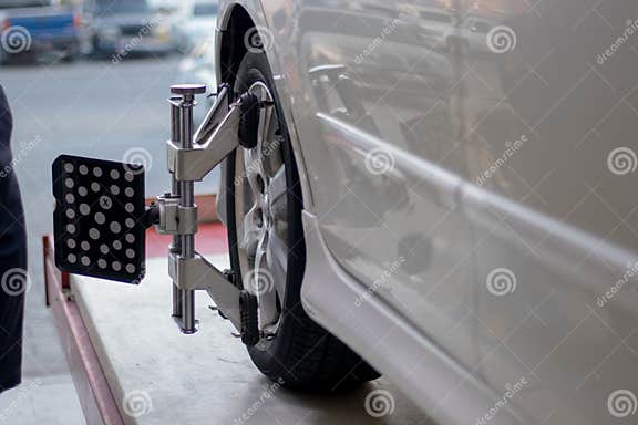 While Aligning the Wheels, the Technician Places the Sensor. 3D Wheel ...