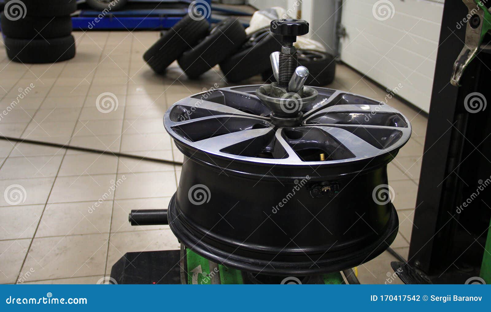 Wheel on Balancing Machine in a Tire Workshop Stock Photo - Image of ...