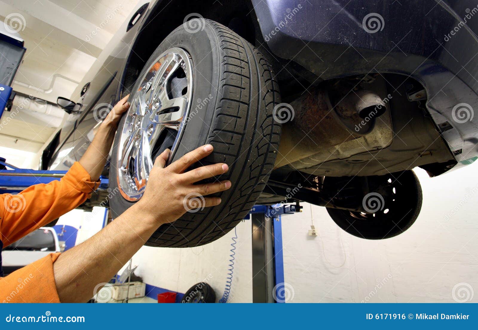 Wheel change stock photo. Image of engineer, wheel, male - 6171916