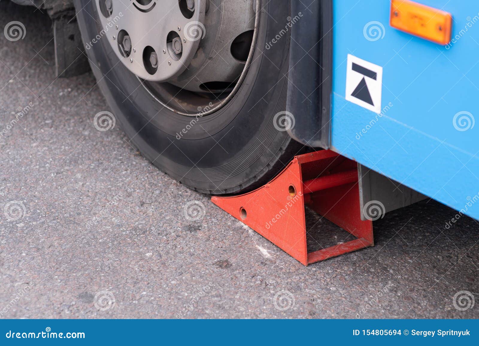 Wheel Chock Under the Wheel of the Bus. Safety in the Operation of ...