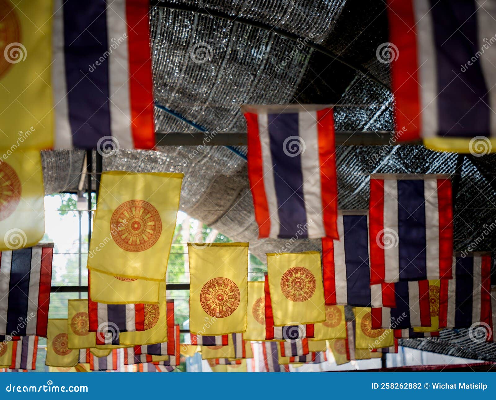 Wheel of Dhamma Flags Hanging on Rails Alternating with the Thai Flags ...
