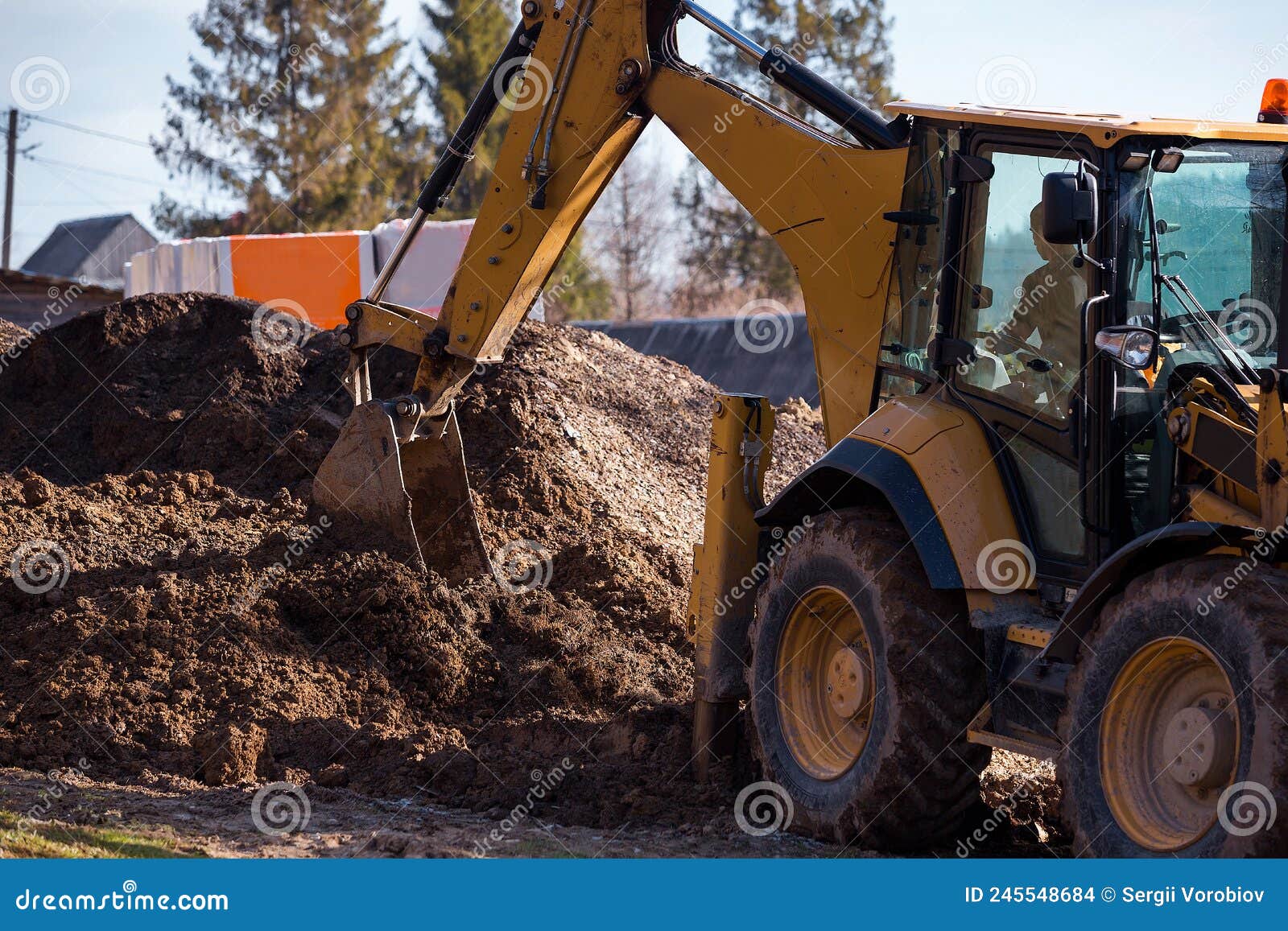 Excavator Loader And Dump Truck During Earthworks At A Construction ...