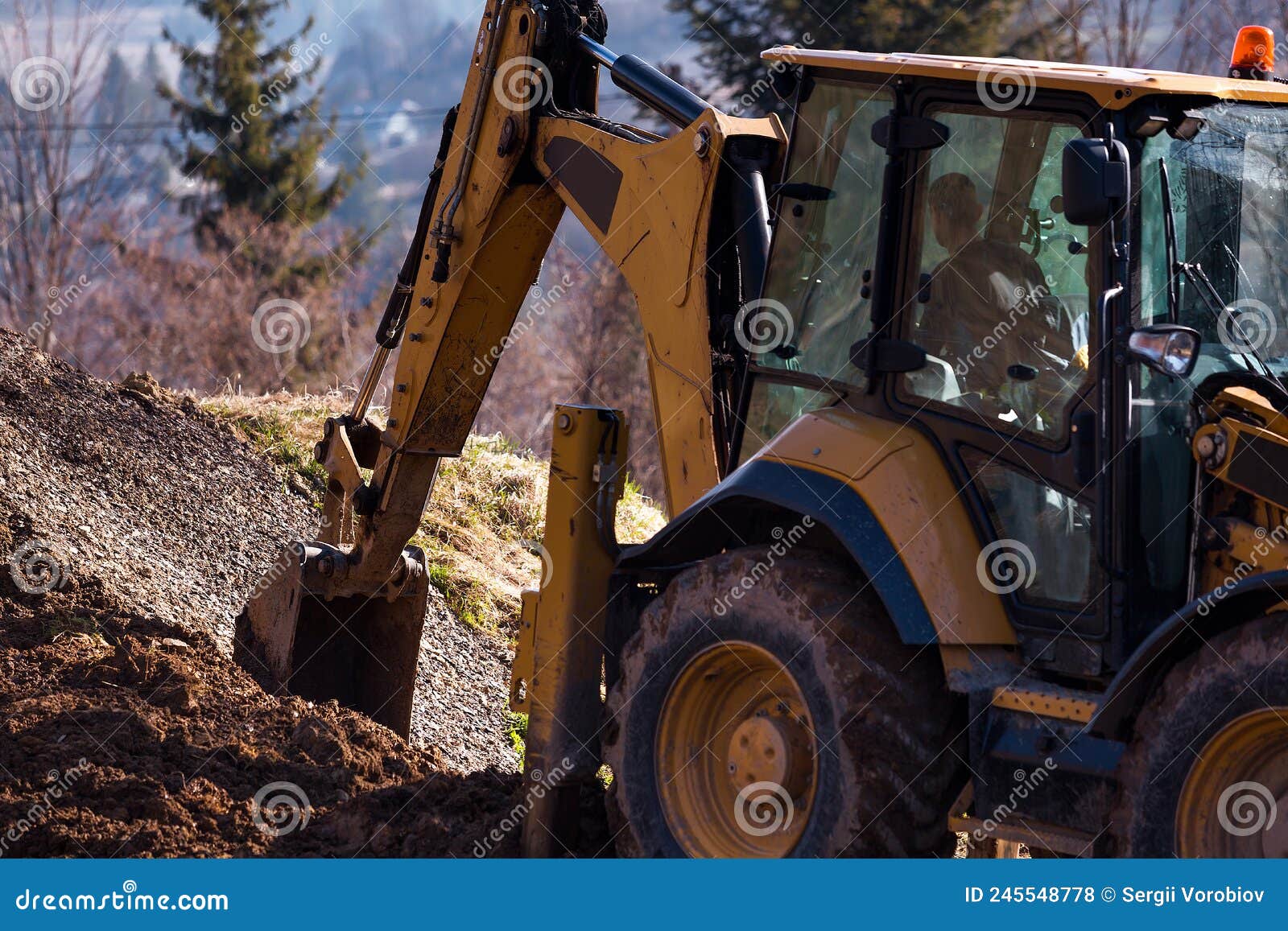 Wheel Excavator Loader is Digging the Soil at the Construction Site ...