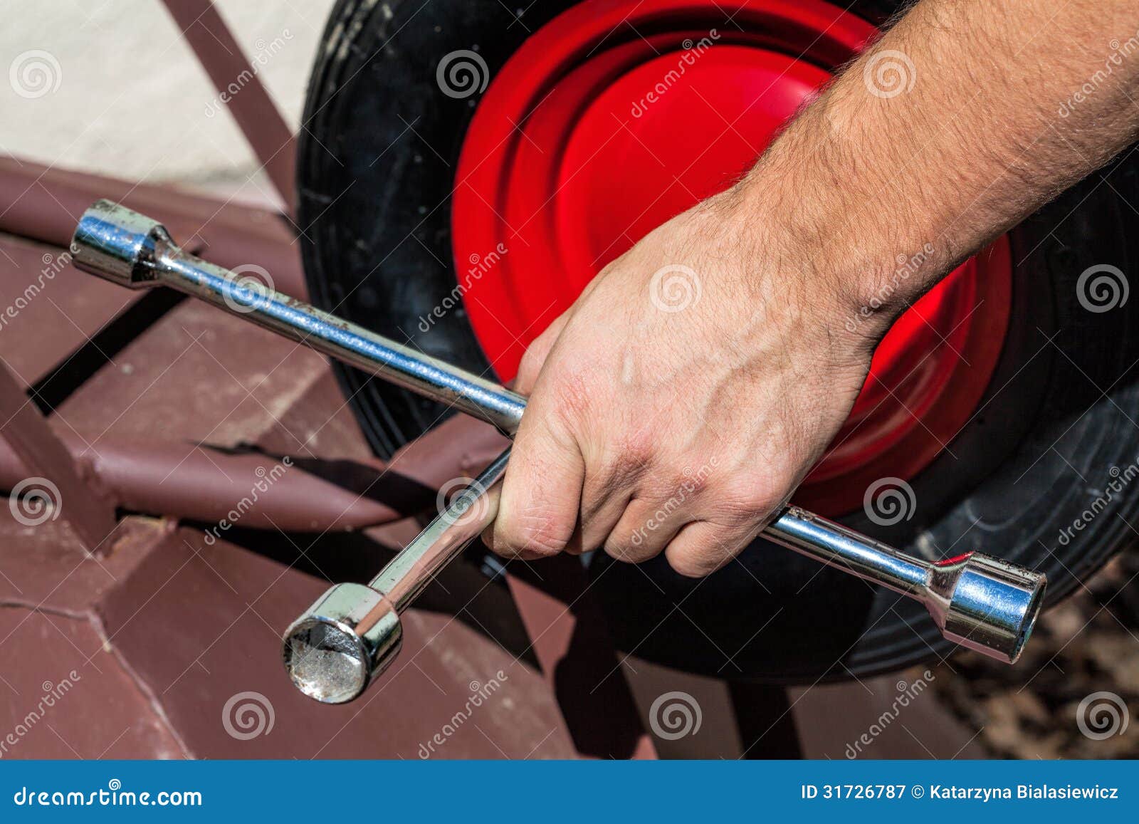 Wheel Fixing with a Spanner Stock Image - Image of gardening, repair ...
