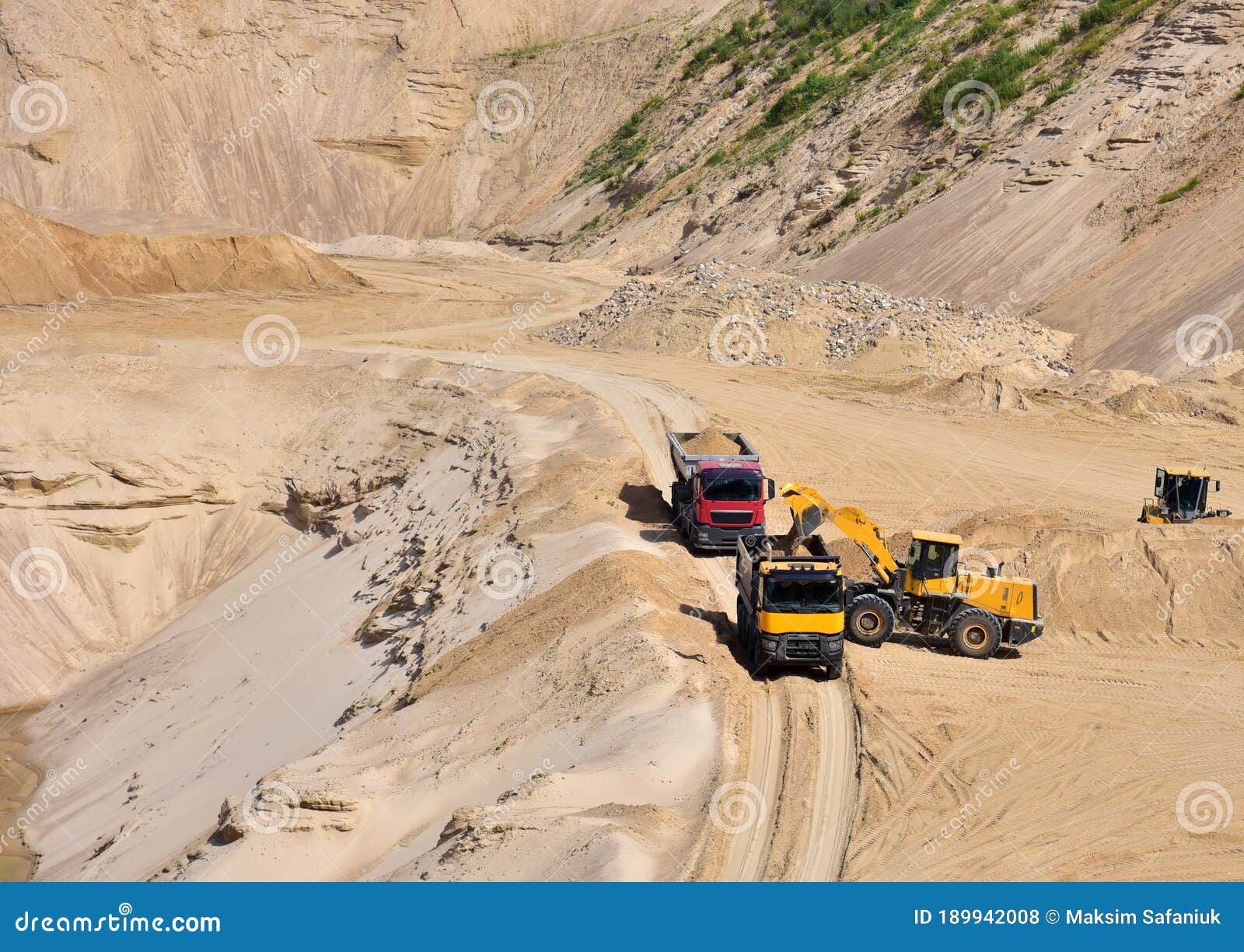 Wheel Front-end Loader Loading Sand into Heavy Dump Truck at the ...