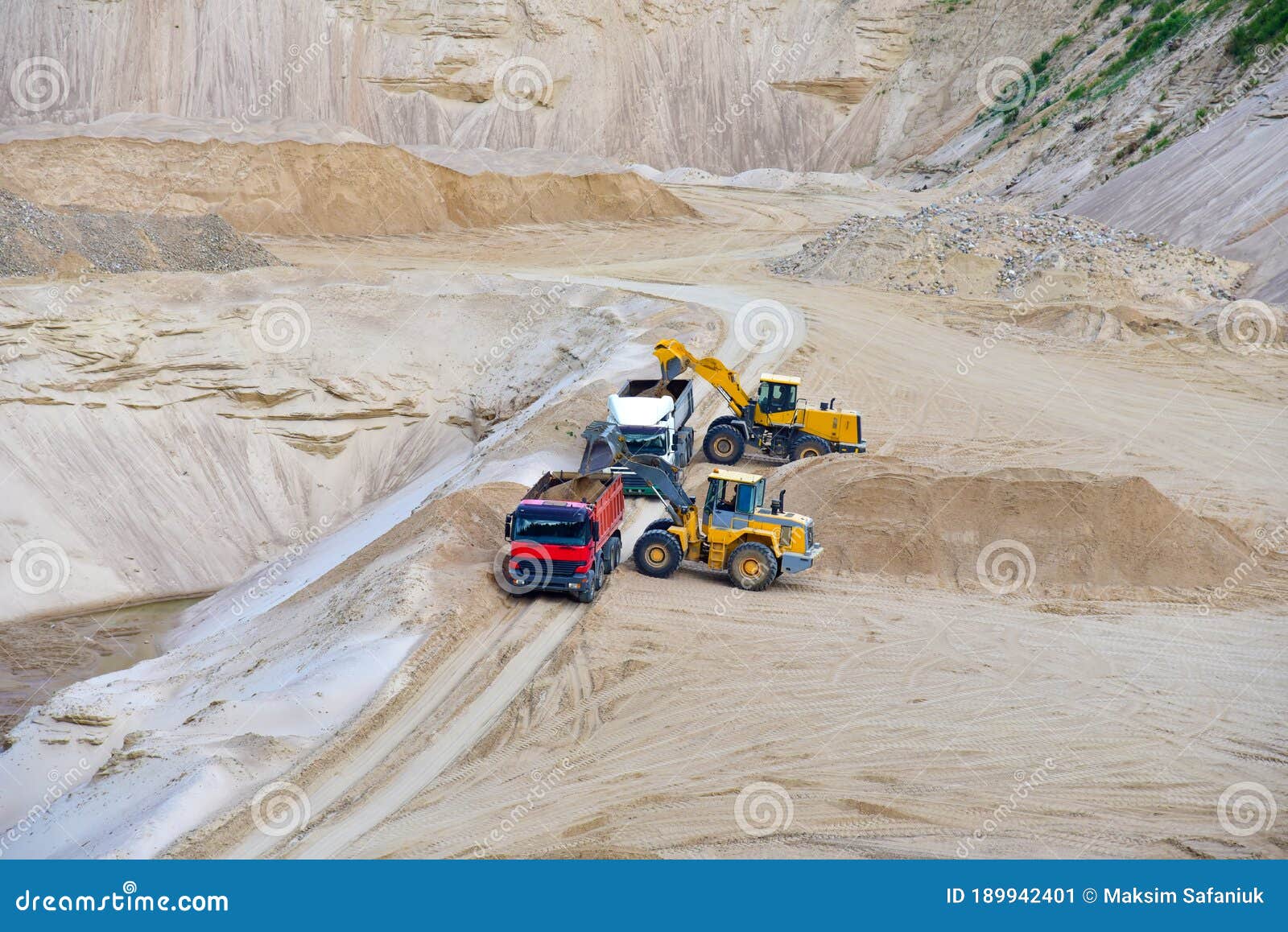 Wheel Front-end Loader Loading Sand into Heavy Dump Truck at the ...