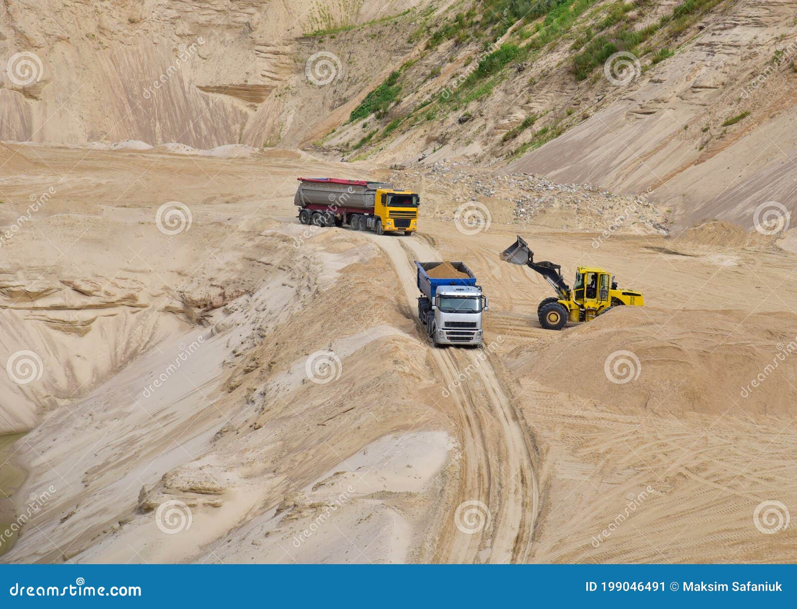 Wheel Front-end Loader Loading Sand into Heavy Dump Truck at the ...