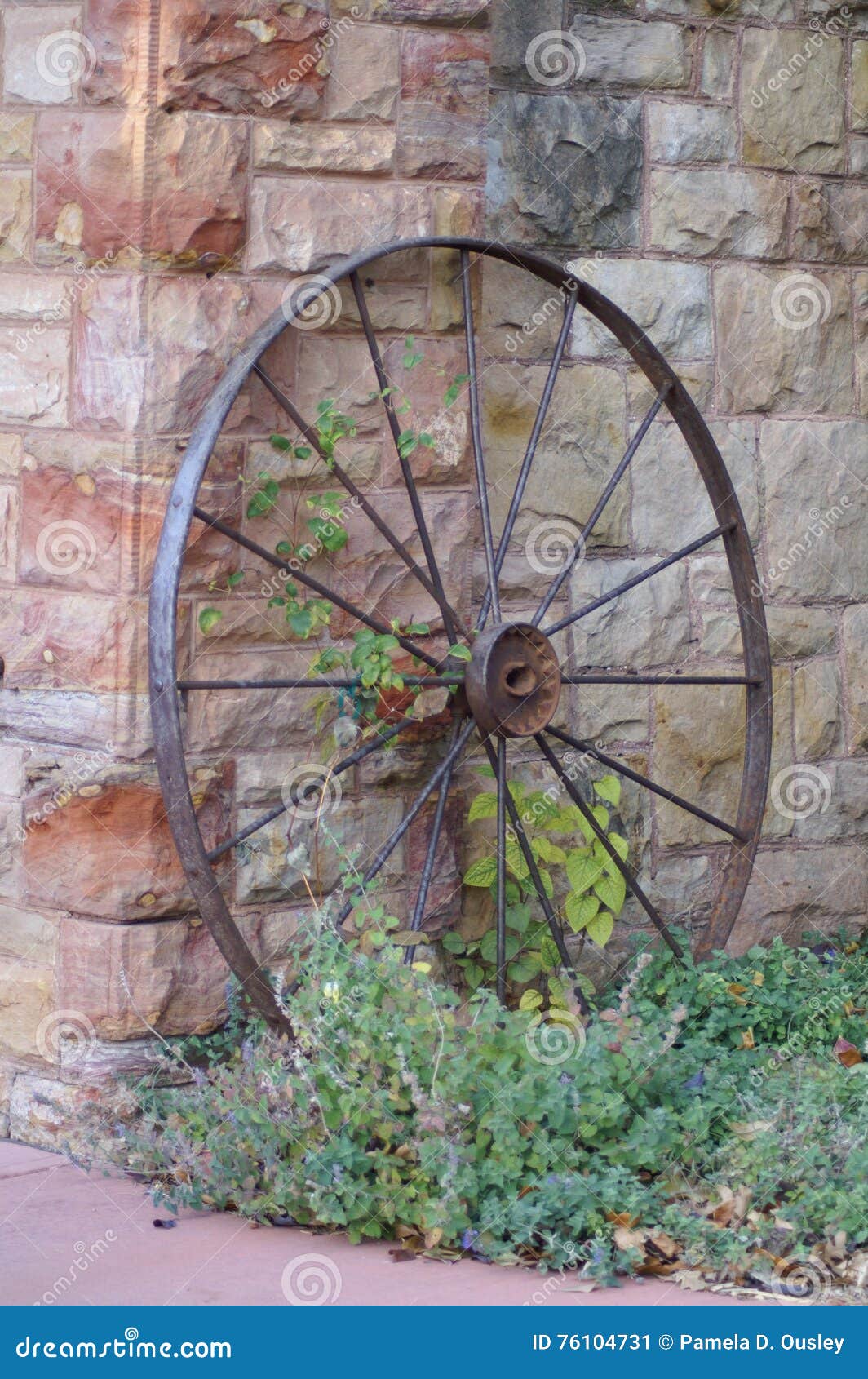 Wheel Leaning Against Brick Stone Wall Stock Image - Image of leaning ...